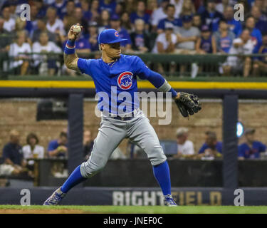 Chicago Cubs' Javier Baez prepares to autograph a baseball before a ...