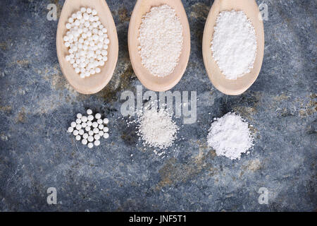 Different types of Granulated cassava (tapioca) on gray background ...