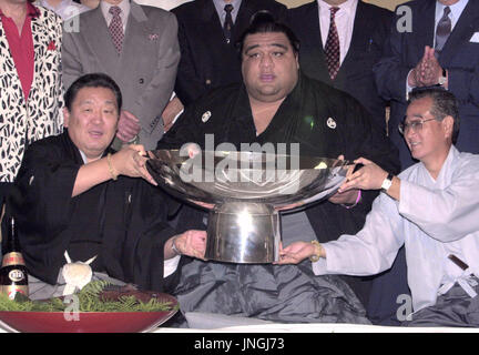 TOKYO, Japan - The Samoa-born yokozuna Musashimaru, surrounded by ...