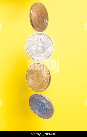 Four virtual coins bitcoins collection on pink Stock Photo - Alamy