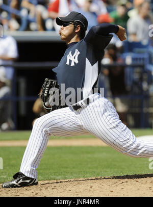 New York Yankees pitcher Kei Igawa of Japan smiles as he answers ...