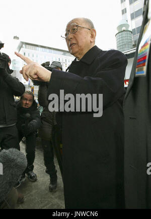 STOCKHOLM, Sweden - Japanese chemist Akira Suzuki waves upon leaving a ...