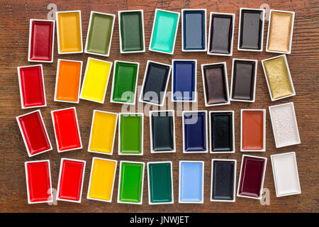 Traditional Japanese watercolors - a set of 36 paints on a grunge wood ...