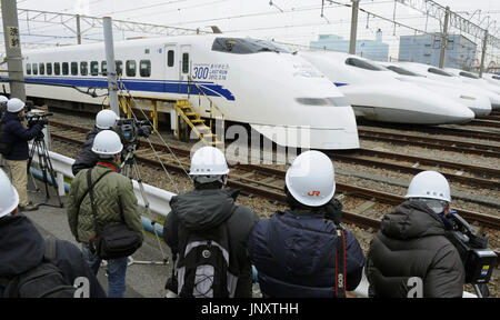 The front of a series 300 shinkansen, bullet train, waiting with lights ...