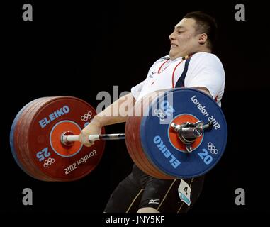London, Britain - Japan's Kazuomi Ota hoists 180 kilograms in the first ...