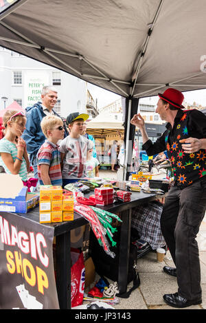 Open market stall with magic tricks on. Zenea, local magician ...