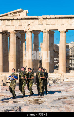 Acropolis. Athens. Greece. Greek soldiers saluting the Greek flag ...