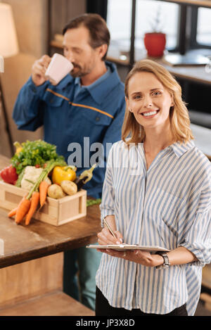 Food delivery woman offering food for delivery Stock Photo - Alamy