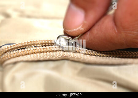 Hand holding small zip-lock kraft paper bag. Ziplock pouch, eco brown ...