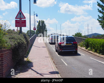 Single lane traffic, give way, UK Urban road sign Stock Photo - Alamy