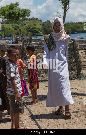 Man walking in the town, Kampung Rinca, Indonesia, Komodo, UNESCO world ...