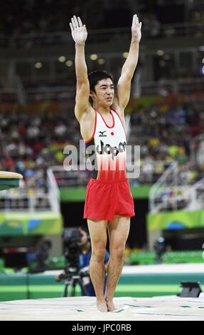 Japanese gymnast Kenzo Shirai smiles and waves to the audience after ...