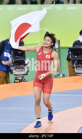 Japan's Kaori Icho celebrates with her country's national flag after ...