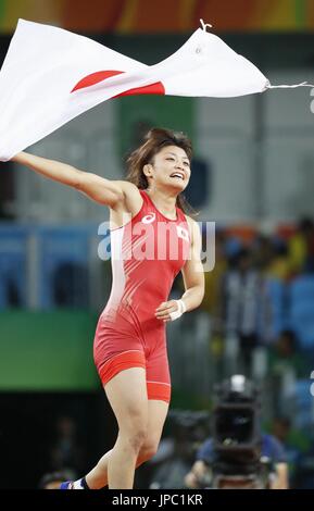 Japan's Kaori Icho celebrates with her country's national flag after ...
