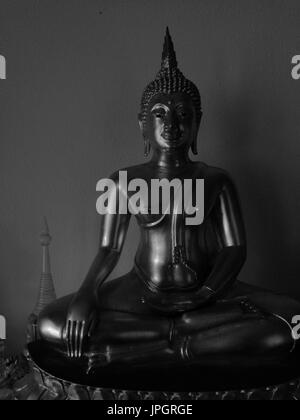 High contrast image of beautiful buddha statue Stock Photo - Alamy