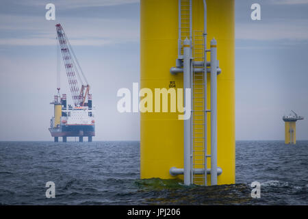 The jack-up vessel, Aeolus, installing the Transition Pieces (TP's) on ...