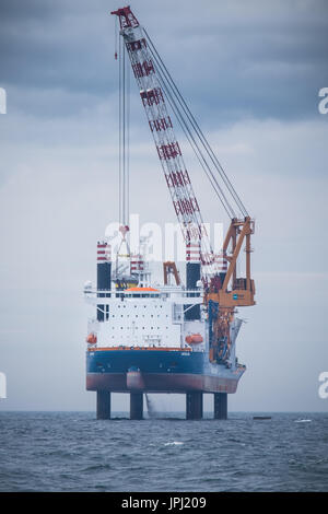 The jack-up vessel, Aeolus, installing the Transition Pieces (TP's) on ...