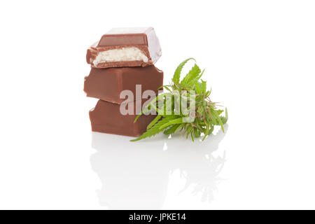 Marijuana chocolate bars with cannabis bud, isolated on white ...