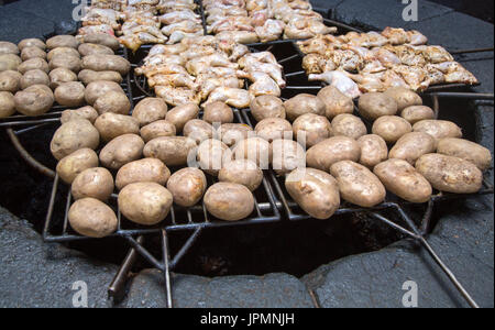 Food being cooked on volcanic grill at visitor centre, Parque Nacional ...