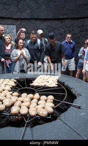 Food being cooked on volcanic grill at visitor centre, Parque Nacional ...