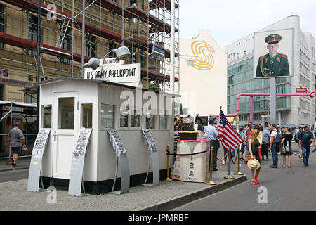 Border checkpoint in West Berlin, with sign 'You are leaving the ...