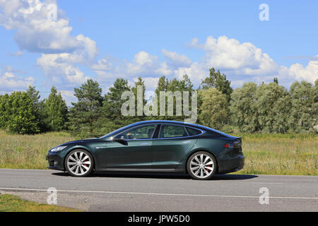 PAIMIO, FINLAND - JULY 29, 2017: Metallic green Tesla Model S electric ...