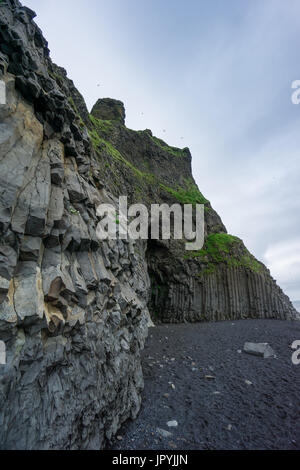 Black Sand Beach with Basalt Columns and Cliffside Cave in Iceland Stock Photo - Alamy