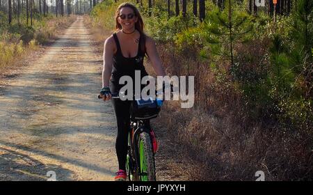 Riding electric bikes on trails Stock Photo - Alamy