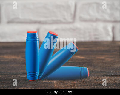 fidget rolling stick toy flip blue color isolated Stock Photo - Alamy
