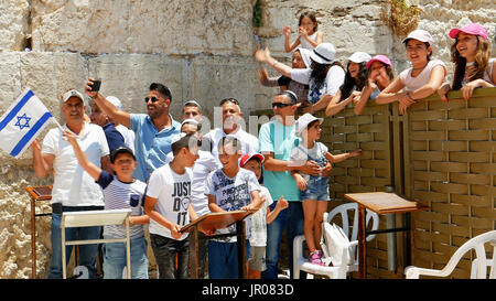 family near wall Stock Photo - Alamy