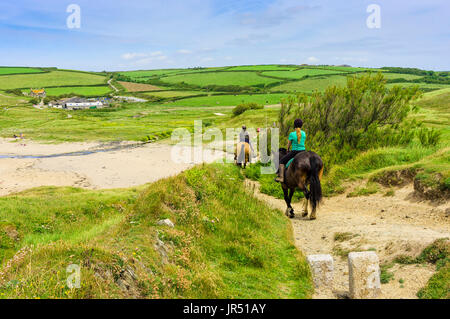 People horse riding on the beach near Søndervig on the west coast of ...