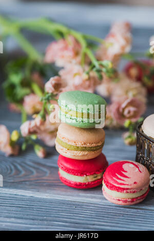 Colorful rows macarons on vintage pink pastel background Stock Photo ...