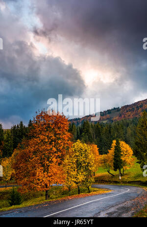 Cloudy sky over the mountains and the asphalt road between them Stock ...
