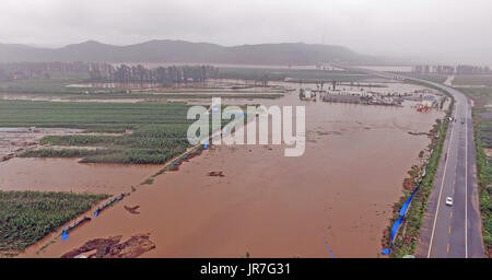 Xiuyan. 4th Aug, 2017. Photo taken on Aug. 4, 2017 shows a damaged road ...