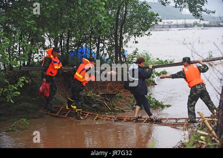 Xiuyan, China's Liaoning Province. 4th Aug, 2017. Villagers rest at a ...