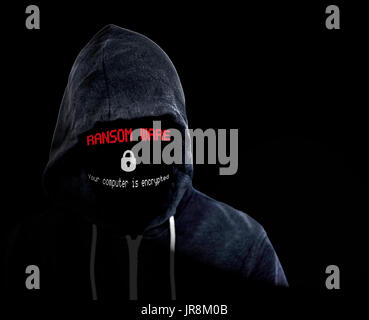 Computer hacking concept with faceless hooded male person using tablet ...