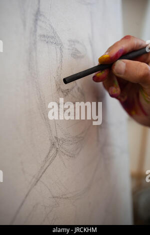 Painter drawing sketch on canvas in studio Stock Photo - Alamy