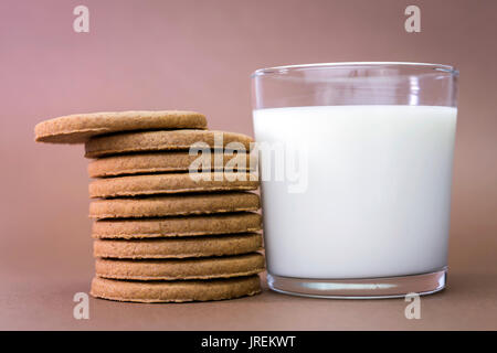 photo of a glass of milk with biscuits Stock Photo - Alamy