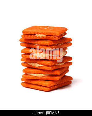 Orange crackers with filling on orange background Stock Photo - Alamy