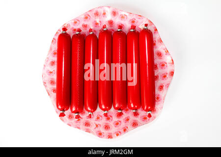 red sausage in pink plate Stock Photo - Alamy