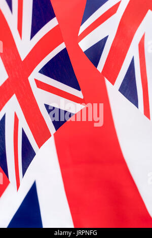 Cluster of mini Union Jack flags. Metaphor British patriotism, being ...