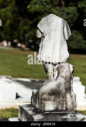 Man standing over grave at cemetery Stock Photo - Alamy