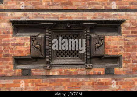 Carved wooden window with lattice work in the traditional Nepalese ...