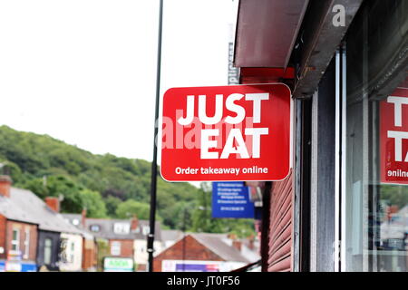 Just Eat sign outside a takeaway restaurant in Plymouth, Devon. J/E is ...