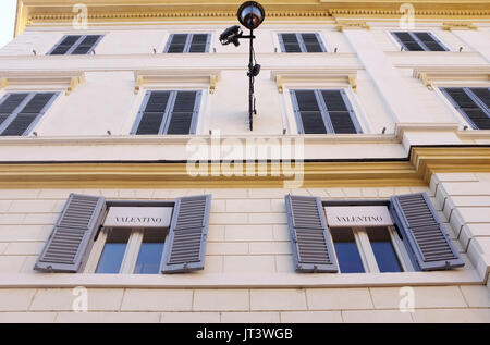 Shop window at Valentino's stores in Piazza Mignanelli are lined with ...
