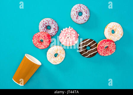 Overhead view of scattered several donuts with various glaze. donuts ...