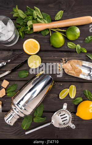 Mojito cocktail ingredients and drinks utensils. On stone table flat ...