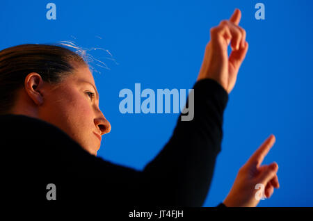 A sign language interpreter performs with the Boston Landmarks ...