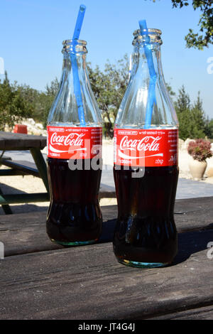 Coca Cola Bottle with Straws Stock Photo - Alamy