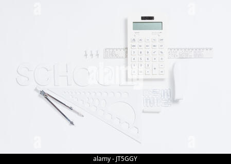 calculator with rulers and stapler with compasses mock-up isolated on ...